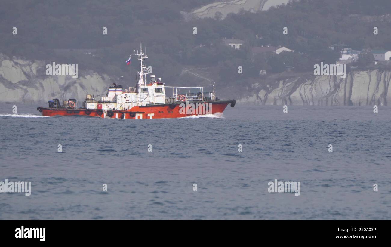 Novorossiysk, Russia - 18 August 2023. red port ship name Captain ...