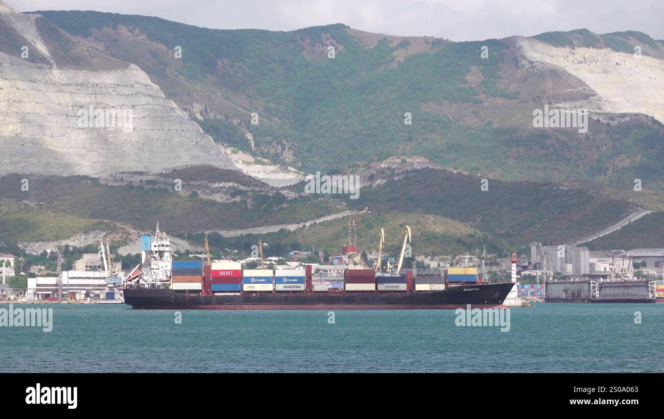 Sea freighter sailing in the middle of the ocean with big waves Stock ...