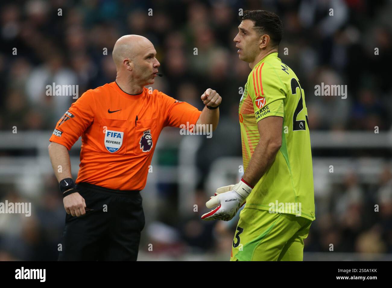 Anthony Taylor warms Aston Villa Goalkeeper Emiliano Martínez during ...