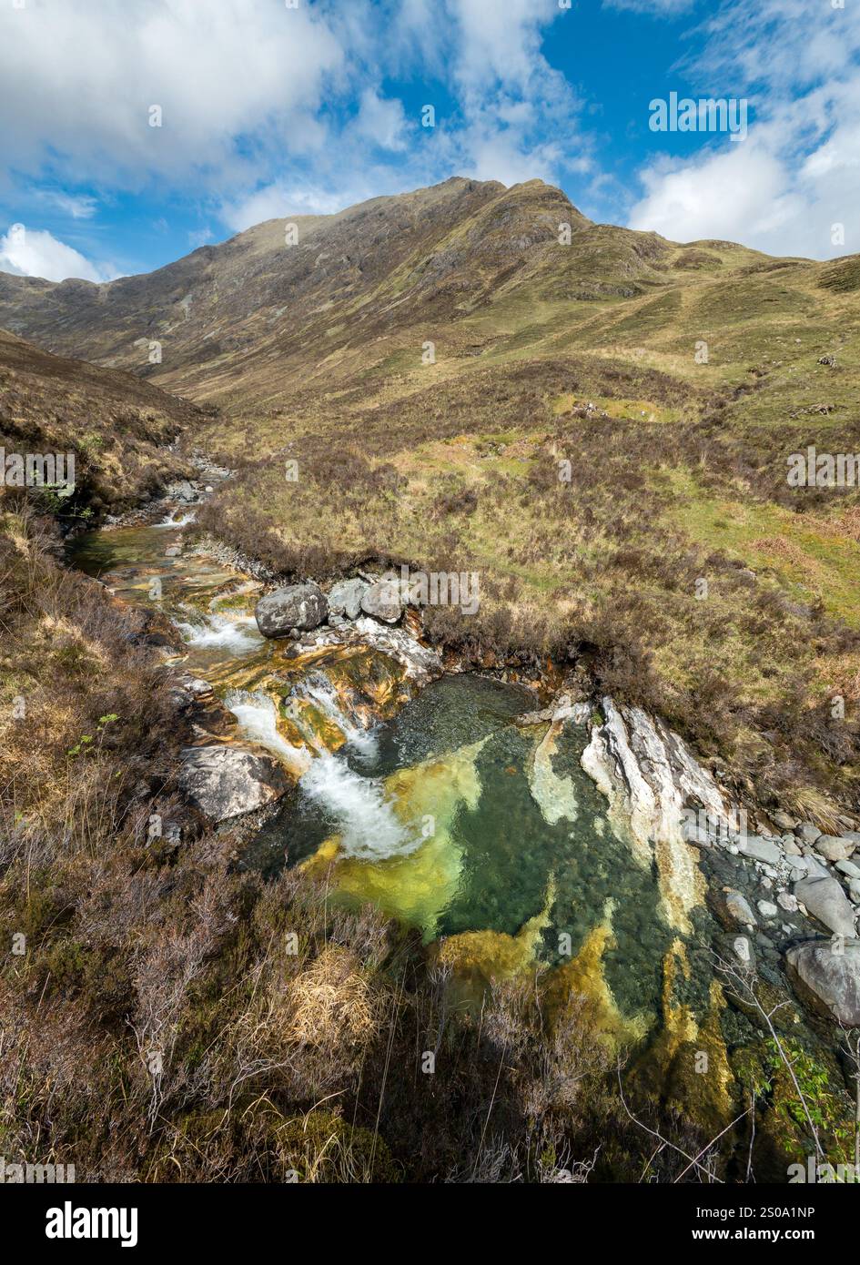 Mountain stream / burn of Allt Aigeinn flowing over white Skye Marble ...