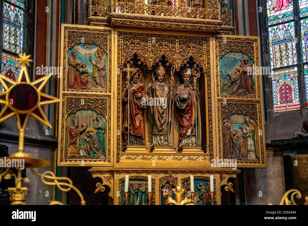 Triptych in Old Archbishop's Chapel, inside St Vitus Cathedral with colorful stained glass ...