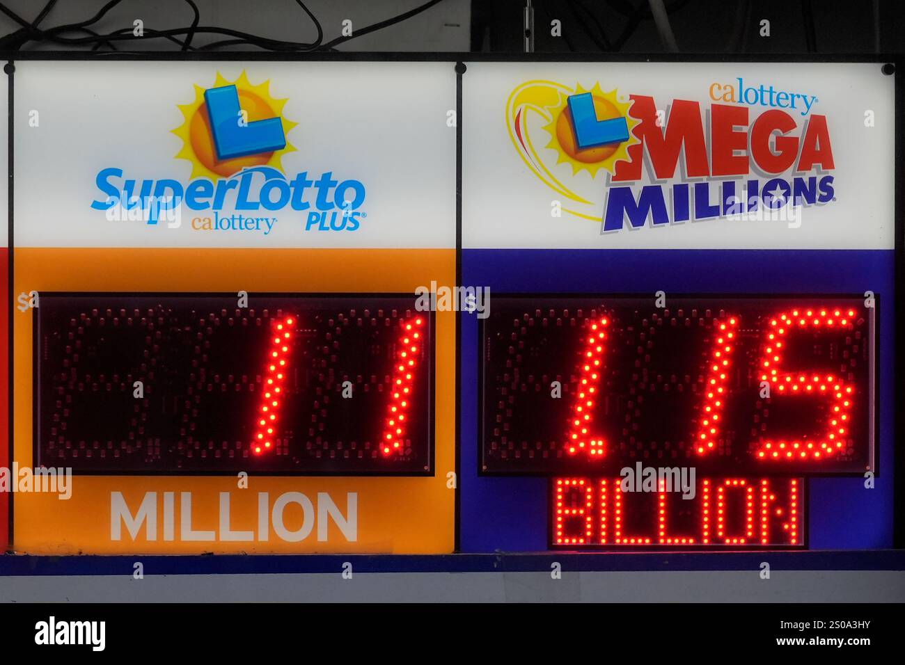 A sign advertising the estimated $1.15 billion Mega Millions jackpot ...