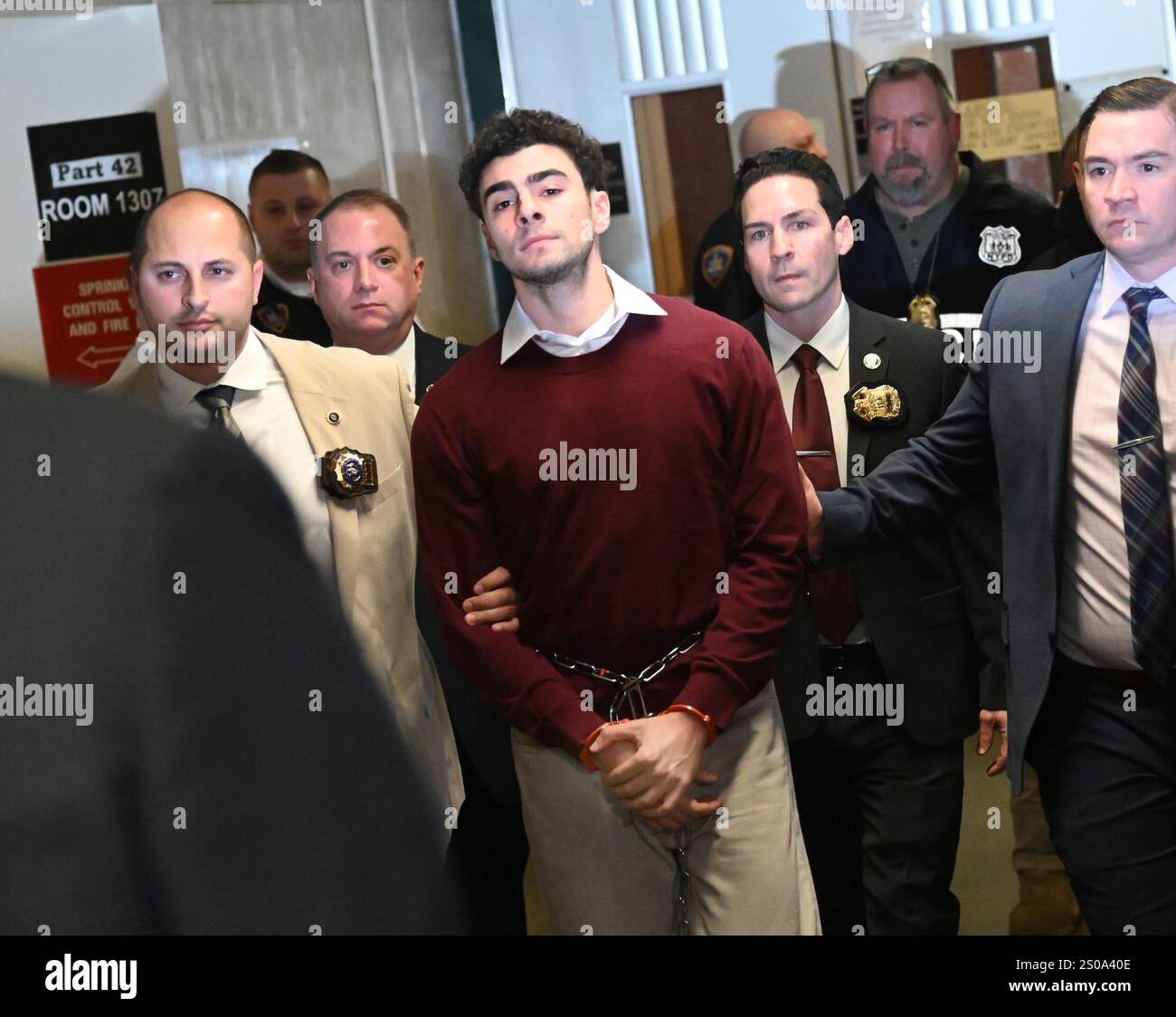 Luigi Mangione is led into State Supreme Court on Monday, December 23 ...