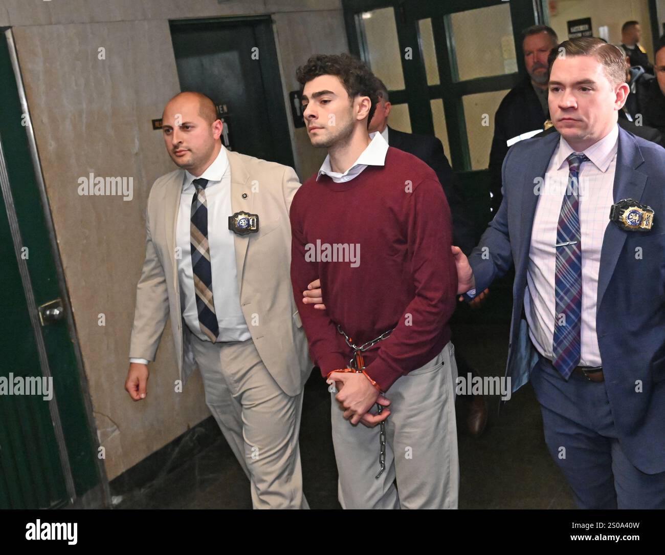 New York, USA. 23rd Dec, 2024. Luigi Mangione is led into State Supreme ...
