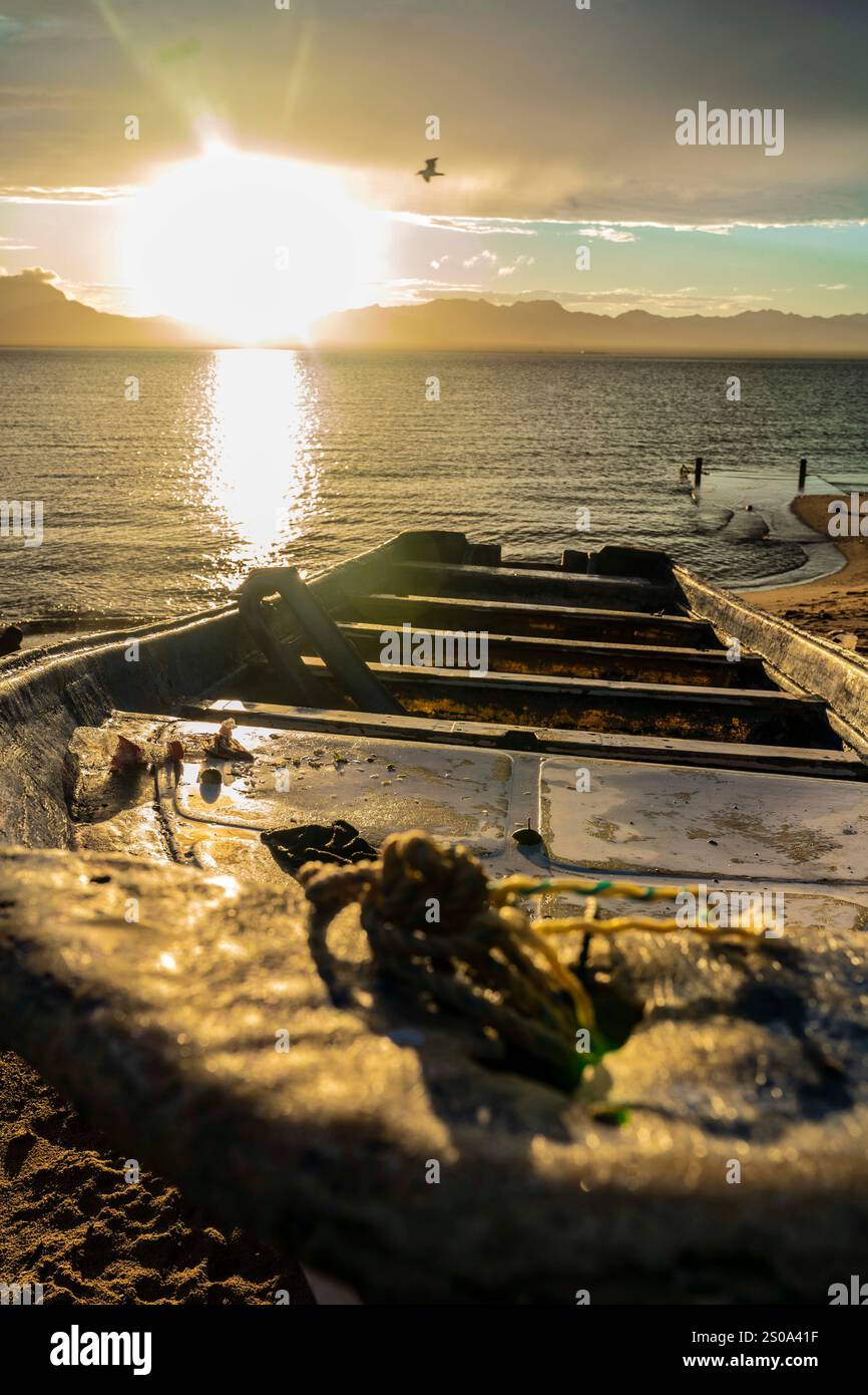 fishing boats on the shore of the beach at sunset and last night ...