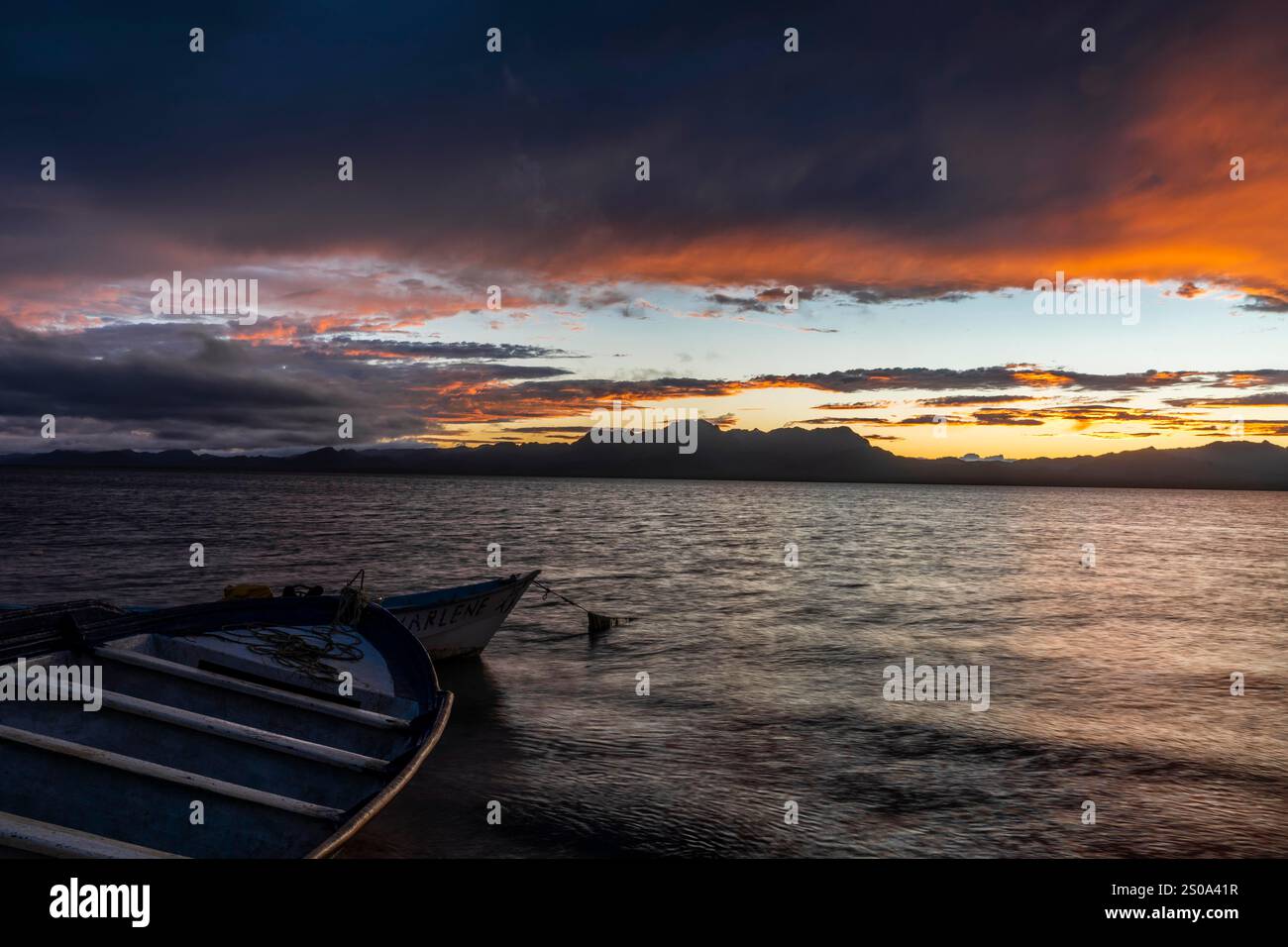 fishing boats on the shore of the beach at sunset and last night ...