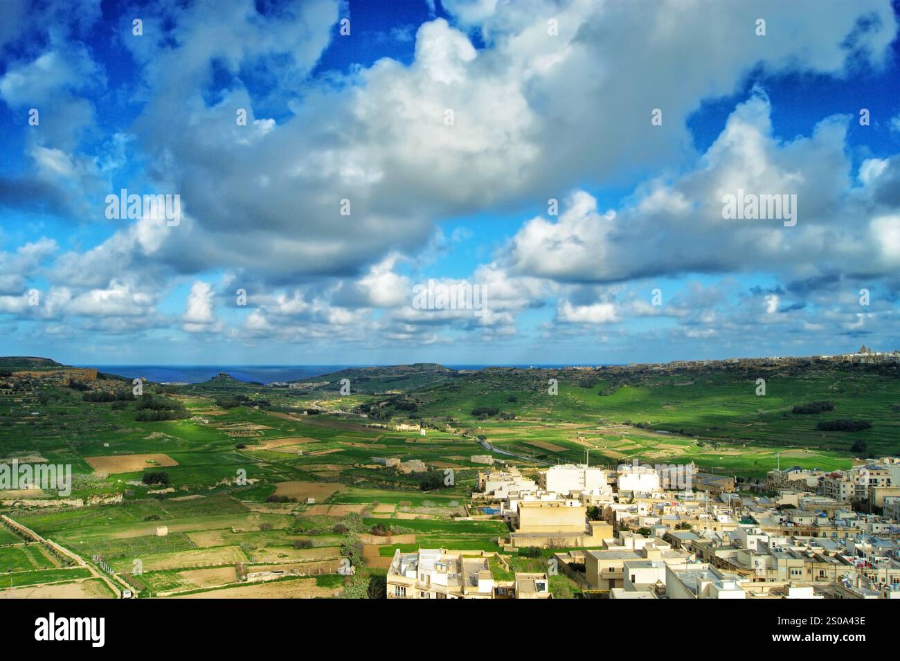 A picturesque view of a green hills with fields from the observation ...