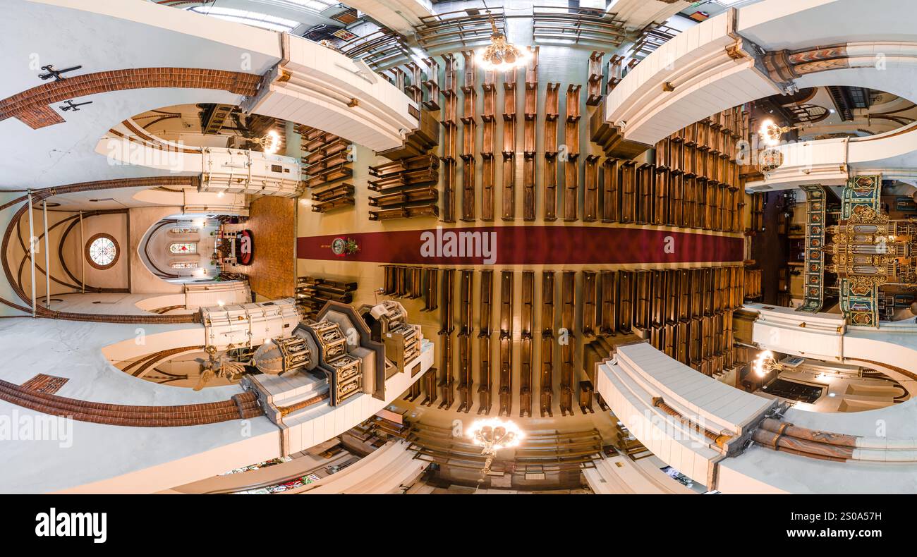 The image captures an aerial view of a cathedral's interior ...