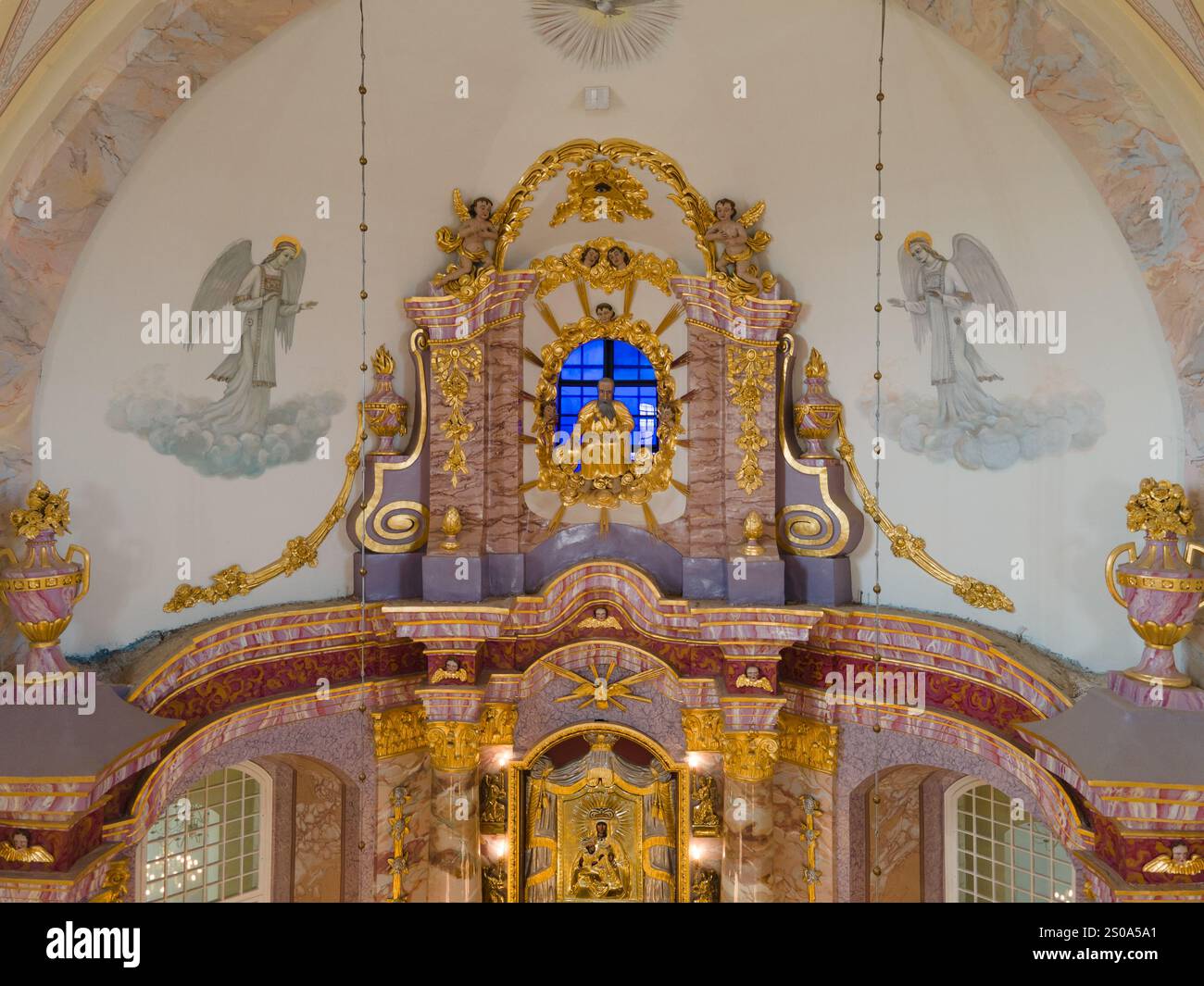 The image captures a cathedral's interior, highlighting a gold accented ...