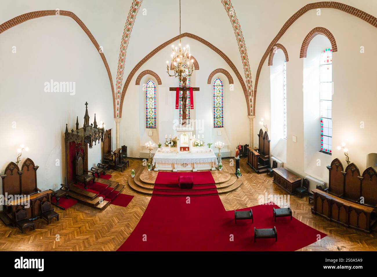 The church interior features high arched ceilings, intricate brickwork ...