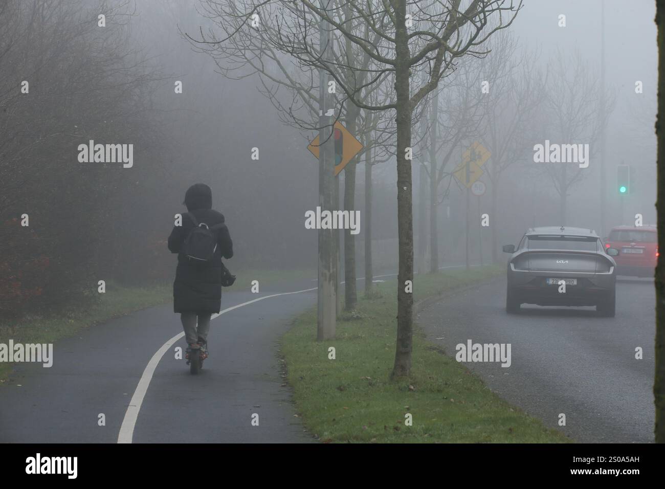 Dublin, Ireland - December 26th 2024 - A woman on a e-scooter. An urban ...