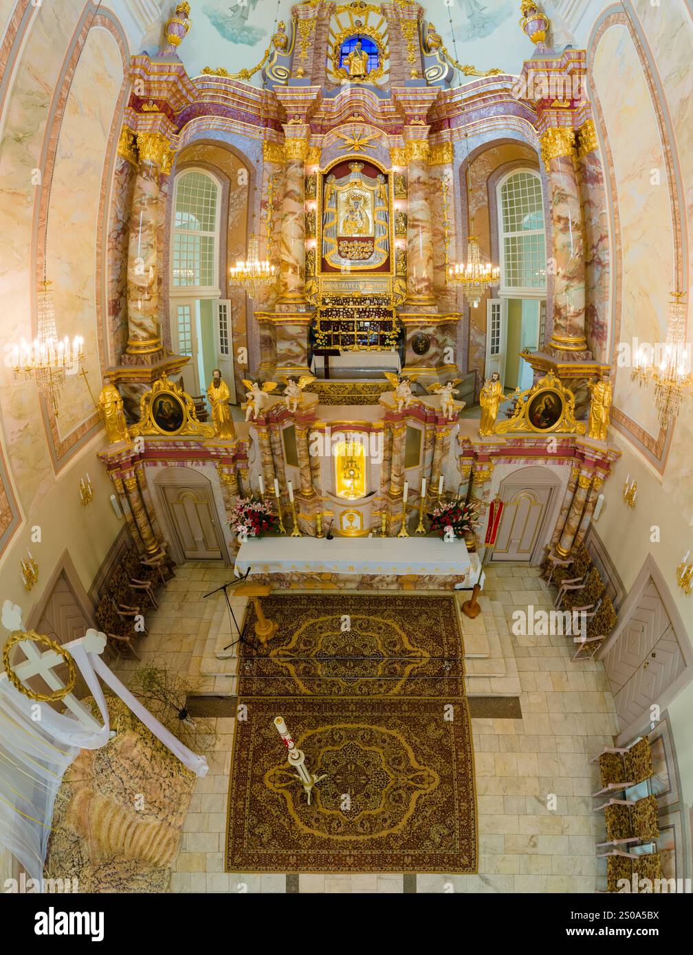 The image captures the richly decorated altar of a cathedral, featuring ...