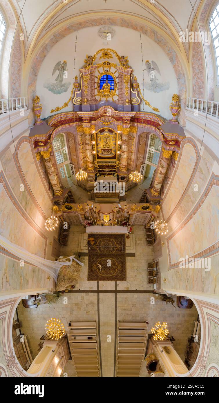The image captures an aerial view of a cathedral's interior ...