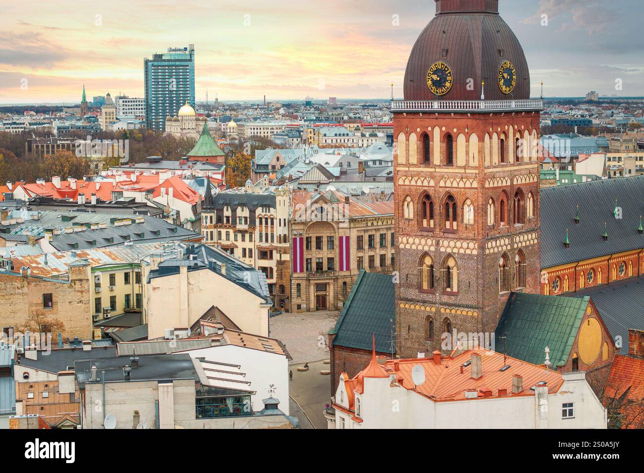 Riga Cathedral's clock tower and intricate brickwork stand out amid ...