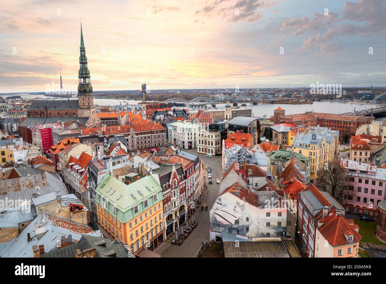 Riga, Latvia's skyline features St. Peter's Church spire, colorful ...