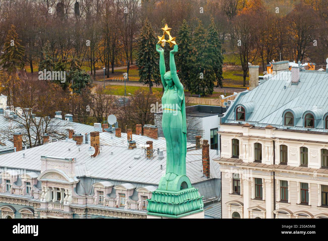 The Freedom Monument in Riga, Latvia, stands tall with Liberty holding ...