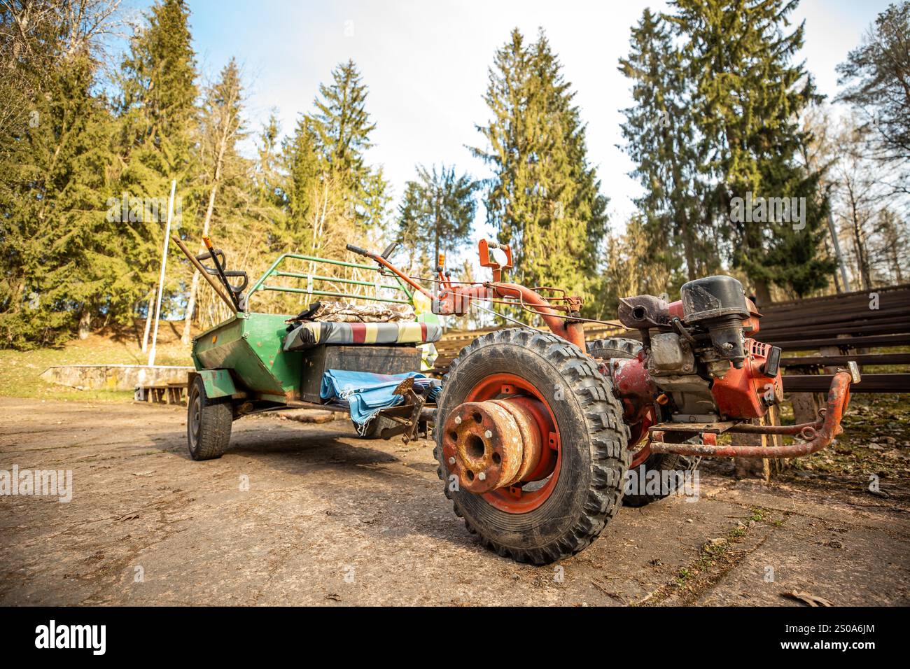 A uniquely constructed tractor with a single front wheel and larger ...