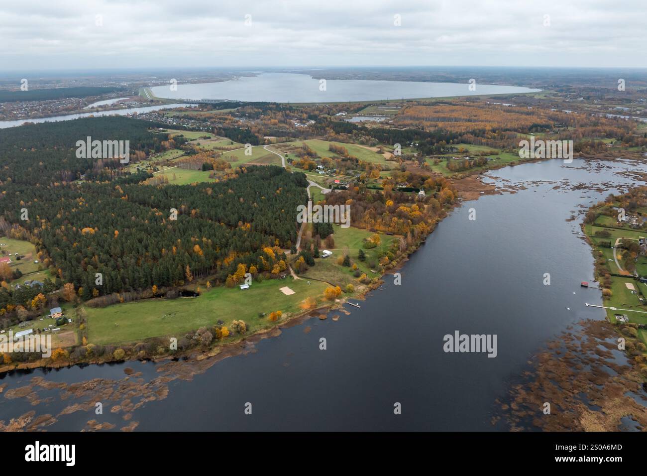 An aerial perspective of a rural area featuring forests, open fields ...