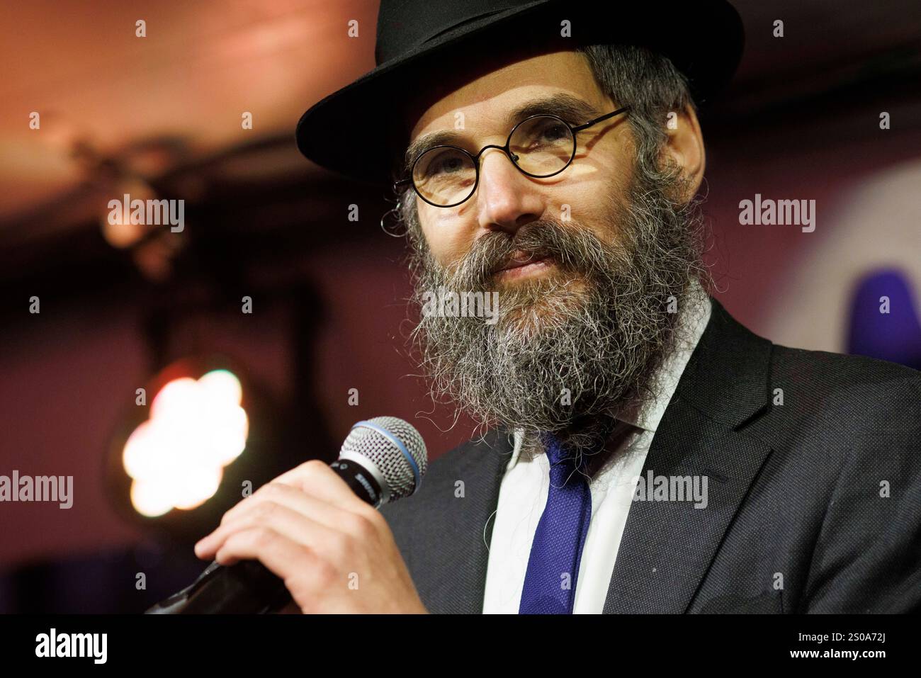 Rabbi Motte Wilhelm led the gathering. Hundreds of people celebrated ...