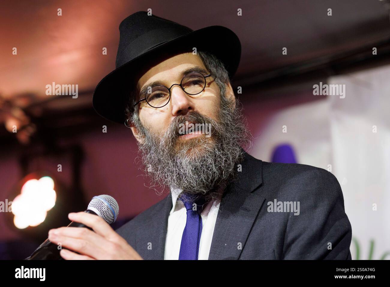 Rabbi Motte Wilhelm led the gathering. Hundreds of people celebrated ...