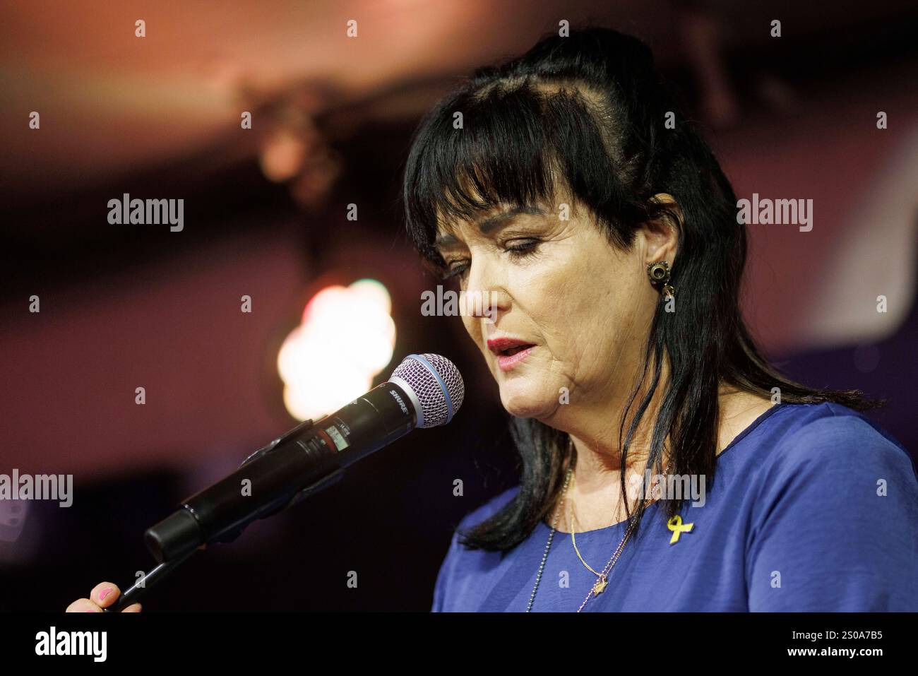 Judith Raanan speaks to the gathering. Hundreds of people celebrated ...