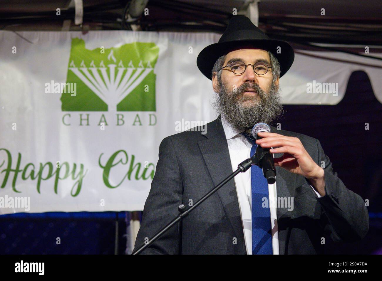 Rabbi Motte Wilhelm led the gathering. Hundreds of people celebrated ...