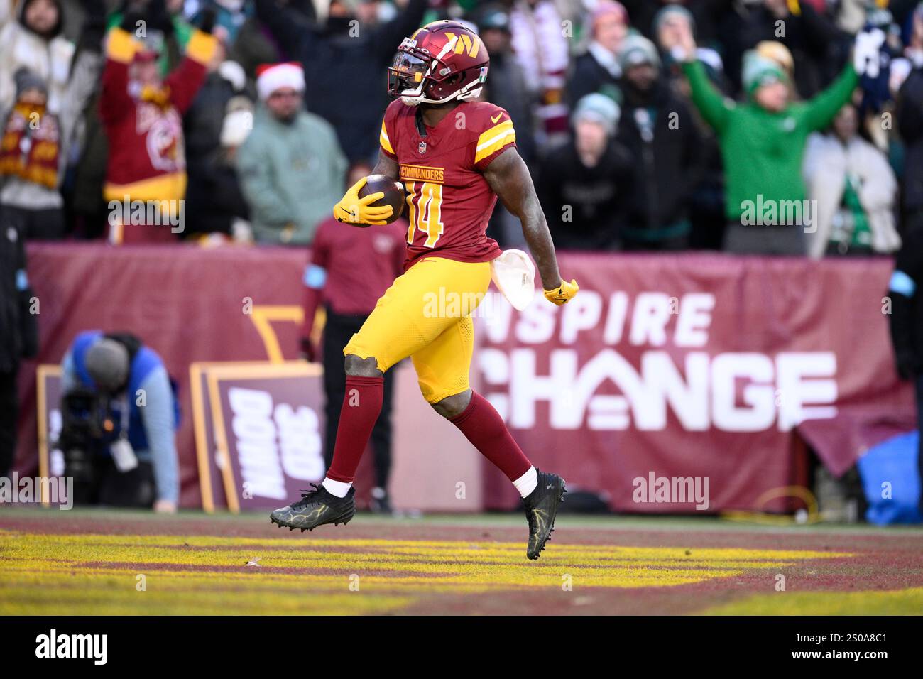 Washington Commanders wide receiver Olamide Zaccheaus (14) scores a ...
