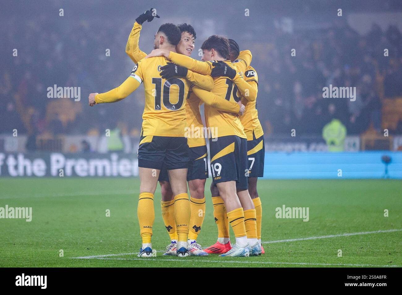 #10, Matheus Cunha hugs goalscorer #11, Hwang Hee-Chan of Wolves during ...