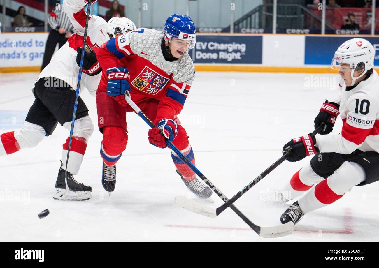 Czechia defenseman Jakub Fibigr (7) loses possession of the puck after ...
