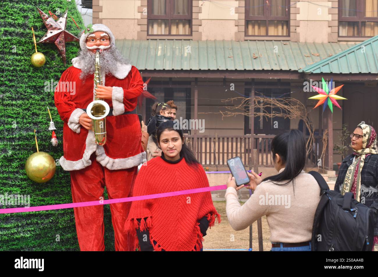 A sculpture of Santa Claus during a mass in the Valley the Holy Family ...