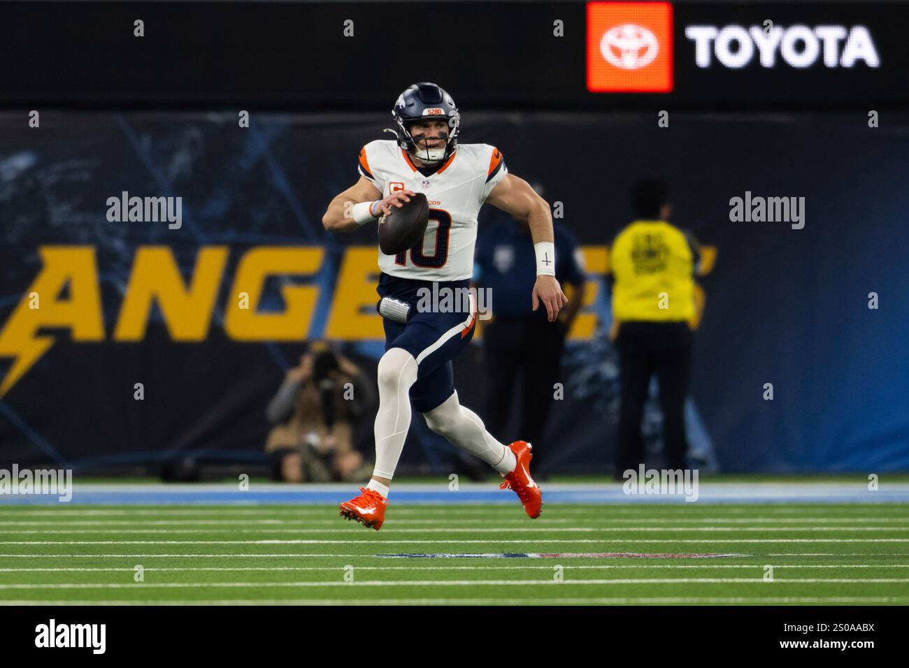Denver Broncos quarterback Bo Nix (10) runs with the ball during an NFL ...