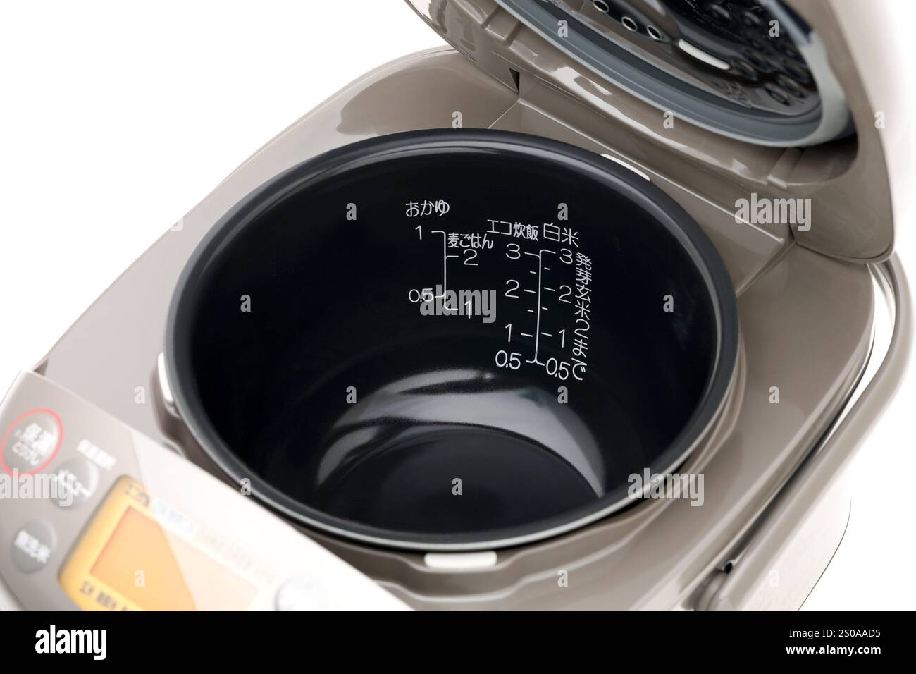 Inside the rice cooker with the lid open. Kitchen equipment electronic ...