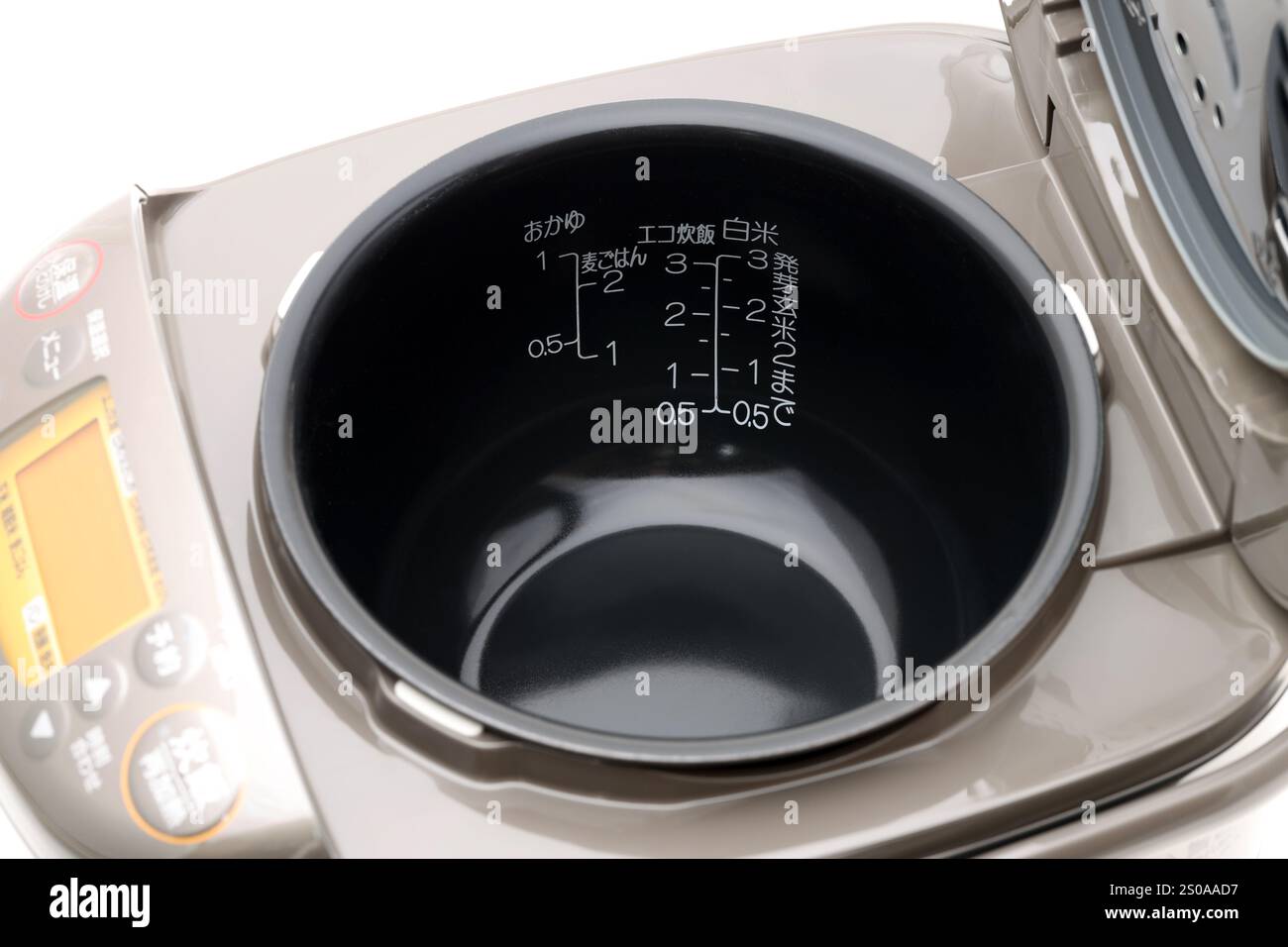 Inside the rice cooker with the lid open. Kitchen equipment electronic ...