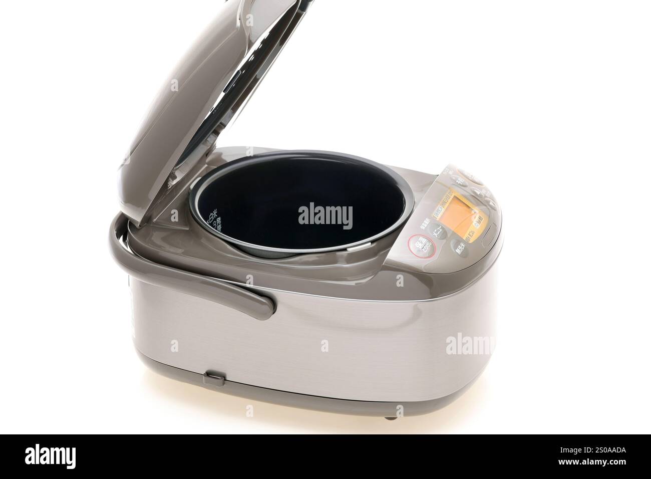 Inside the rice cooker with the lid open. Kitchen equipment electronic ...