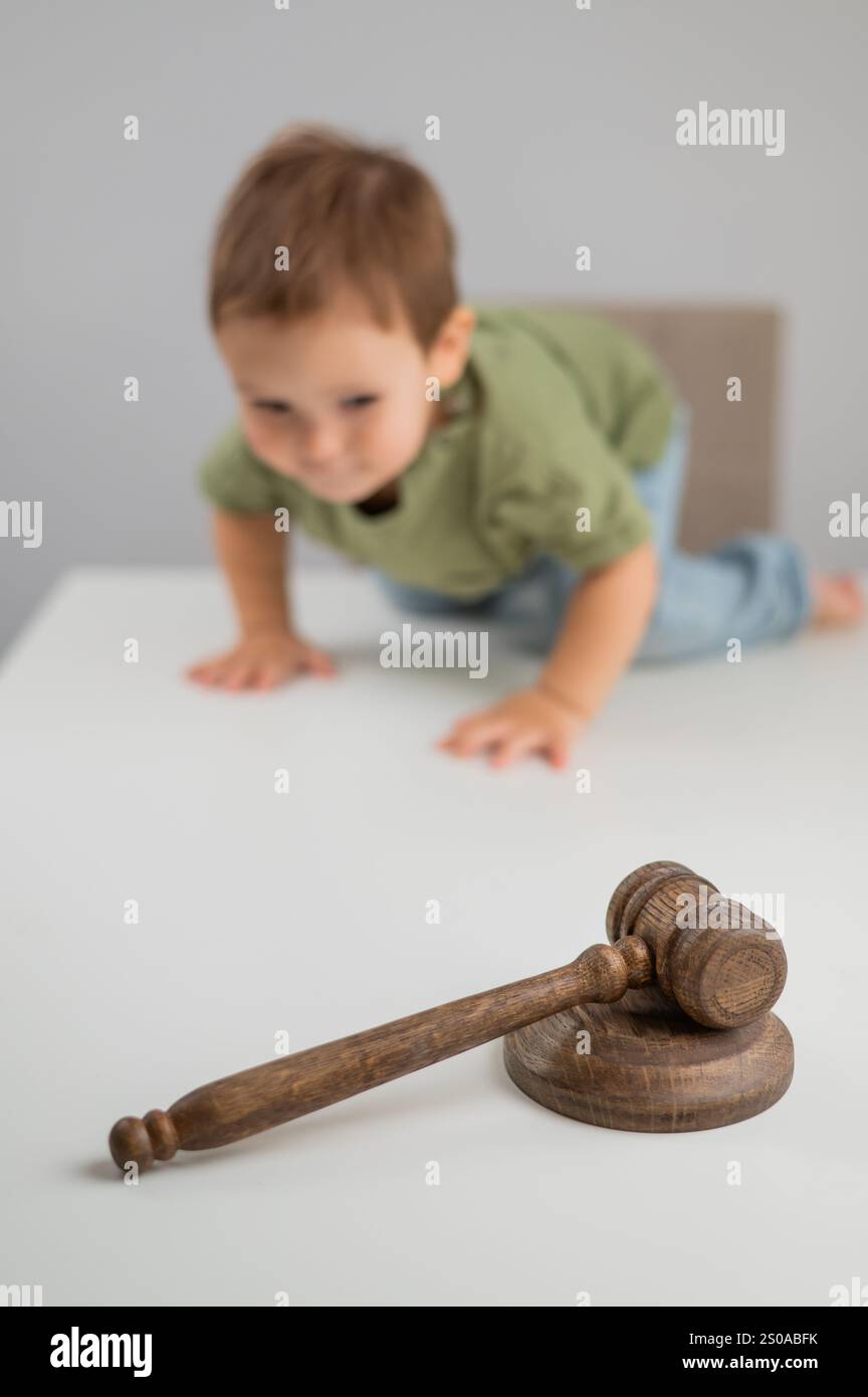 Little boy in front of a judge's gavel Stock Photo - Alamy