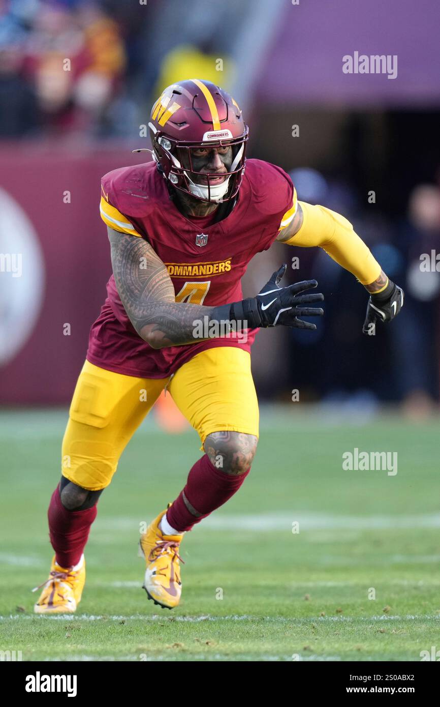 Washington Commanders linebacker Frankie Luvu (4) rushes the passer ...