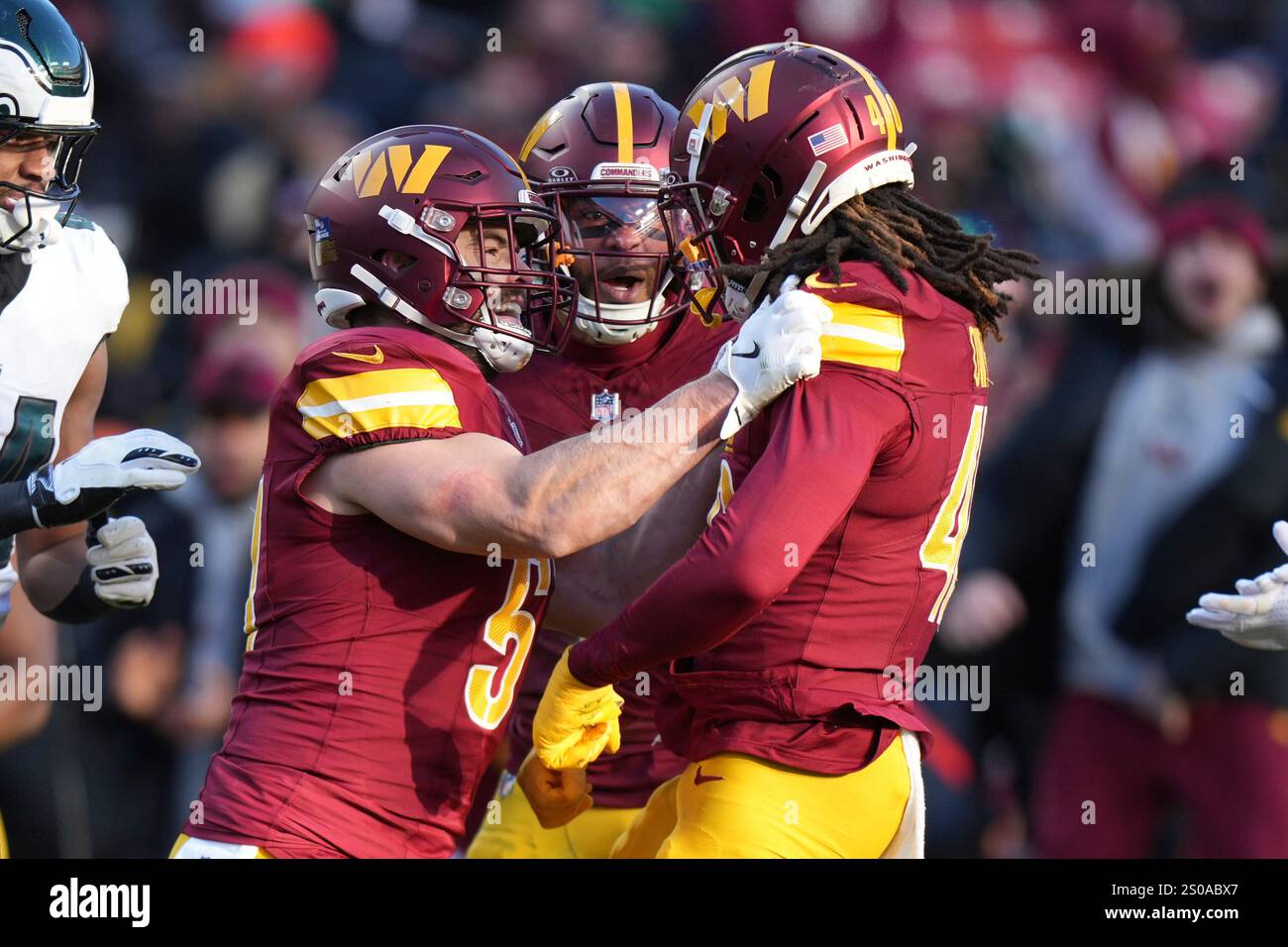 Washington Commanders linebacker Frankie Luvu (4) celebrates his sack ...