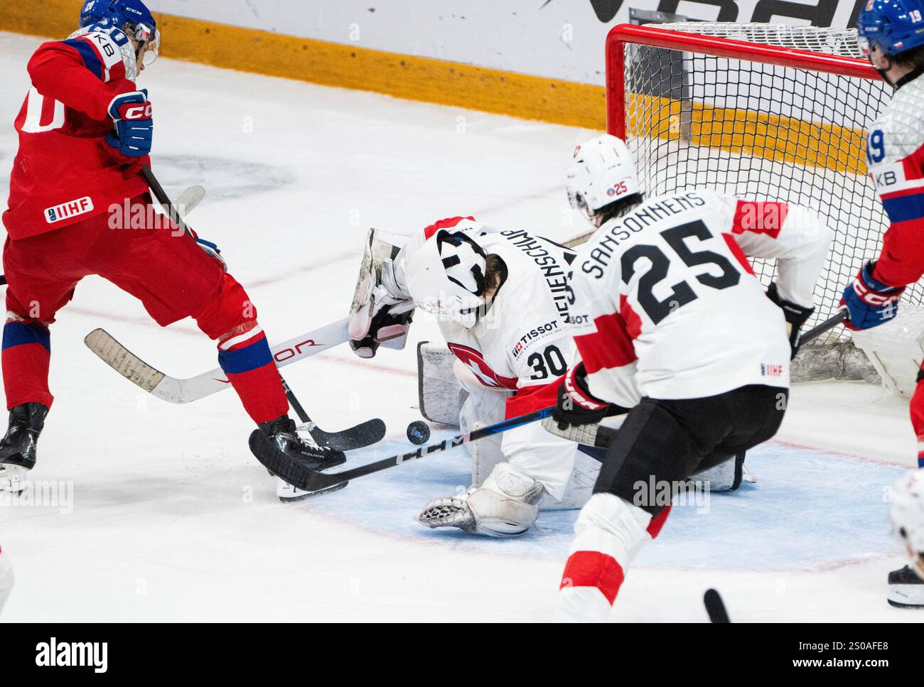 Czechia forward Dominik Petr (20) is stopped by Switzerland goaltender ...