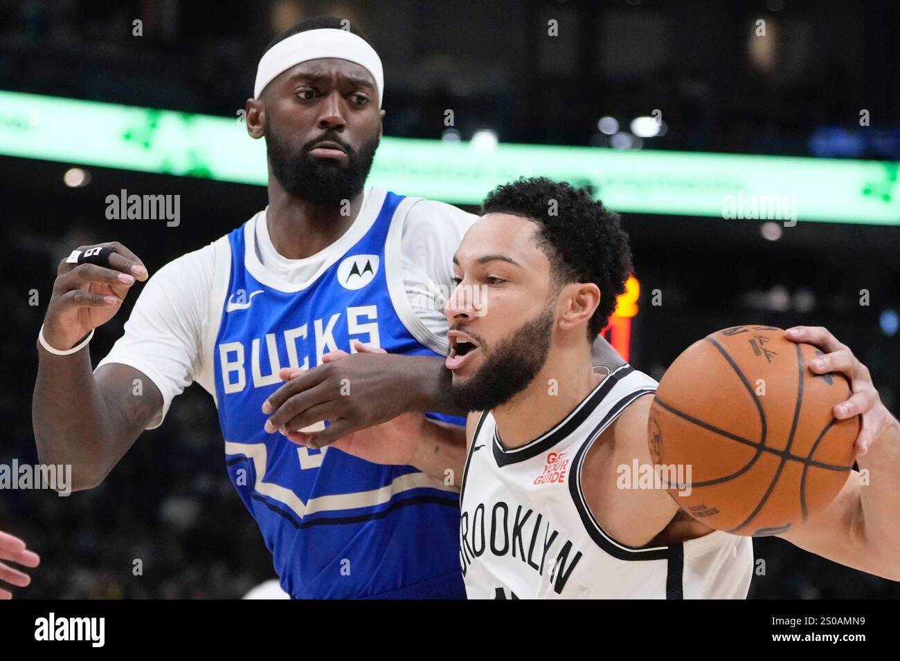 Brooklyn Nets' Ben Simmons tries to drive past Milwaukee Bucks' Bobby ...