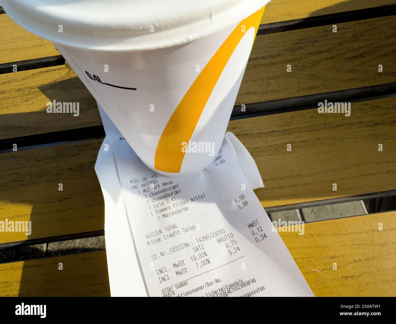 Kehl, Germany - Nov 6, 2024: A McDonald's receipt rests on a table next ...