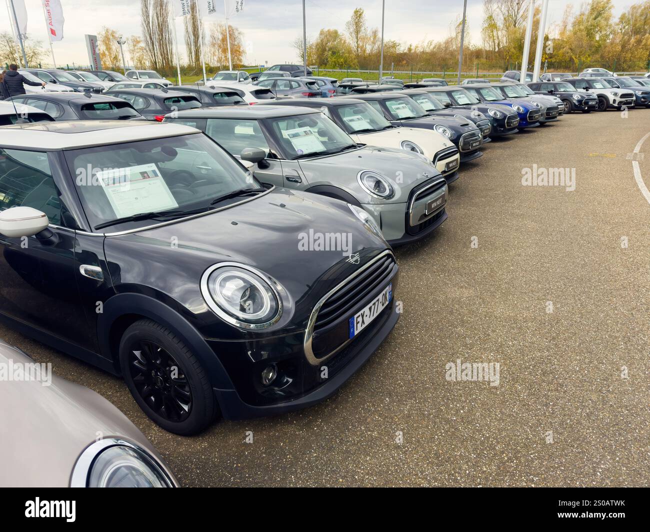 Paris, France - Nov 25, 2024: A lineup of Mini Coopers at a car ...
