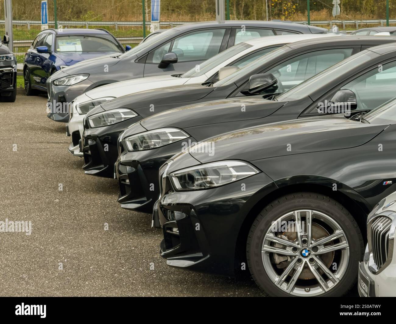 Paris, France - Nov 25, 2024: A lineup of new BMW vehicles displayed in ...