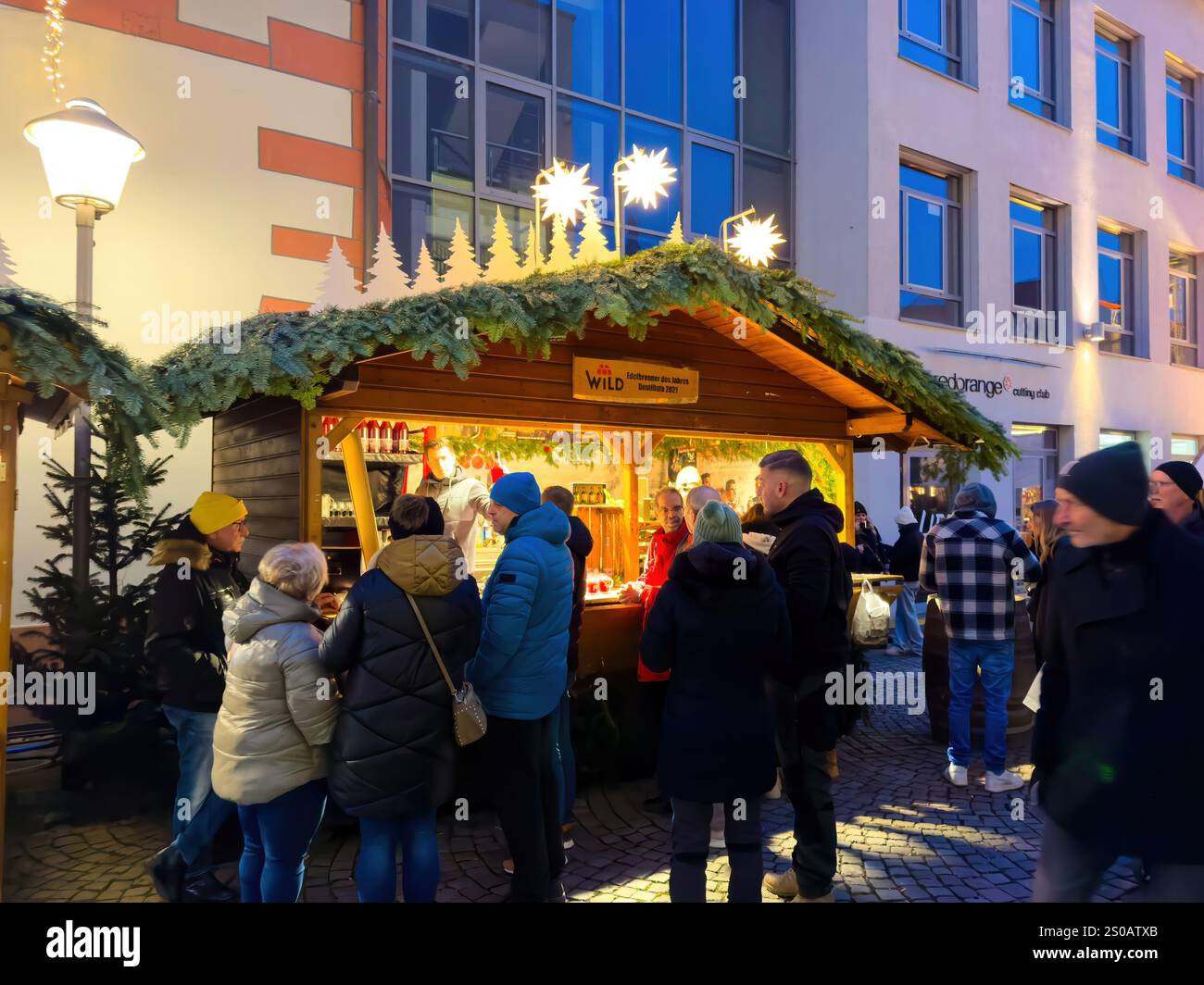 Offenburg, Germany - Nov 30, 2024: A warmly lit wooden stall at ...