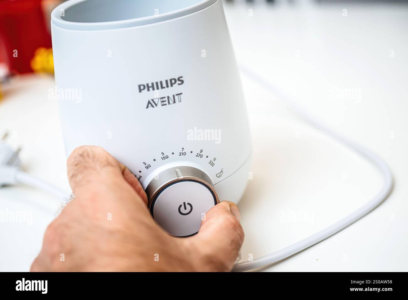 Paris, France - Oct 25, 2023: A person adjusts the dial on a Philips ...
