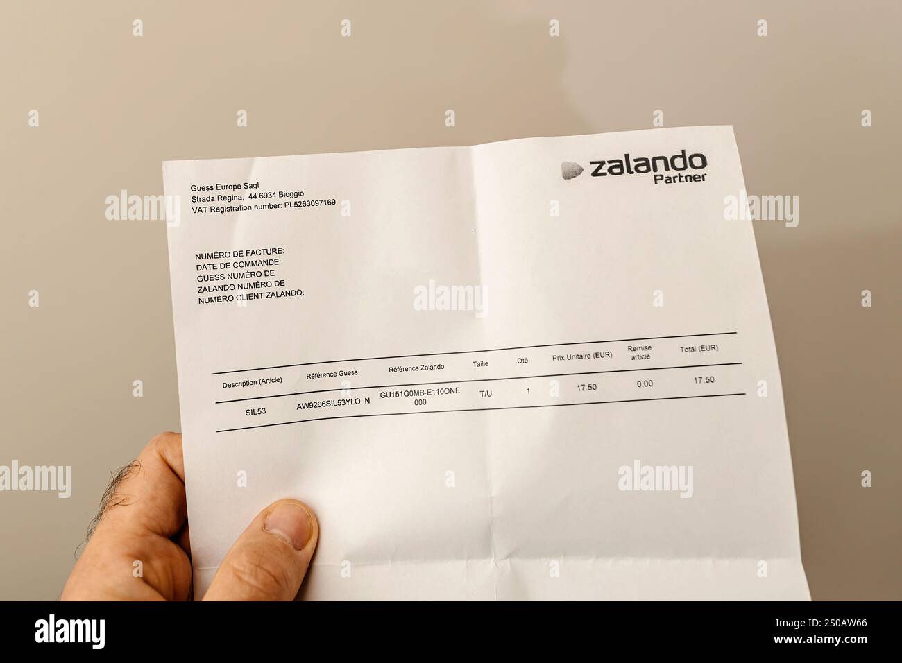 Paris, France - Oct 25, 2023: Hand holding a Zalando Partner invoice ...