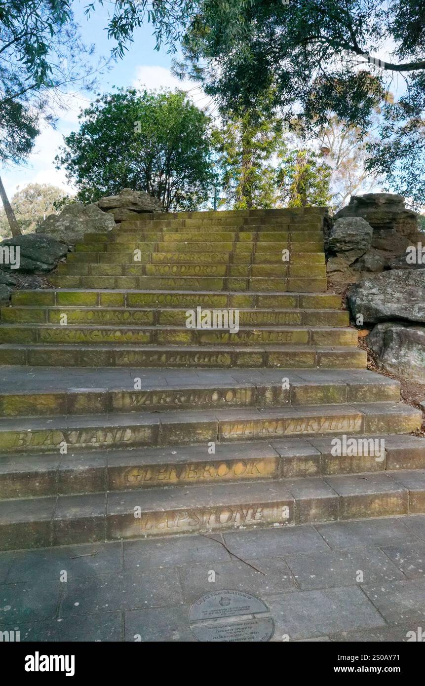 A moss-covered historical stairway with the names of Blue Mountains ...