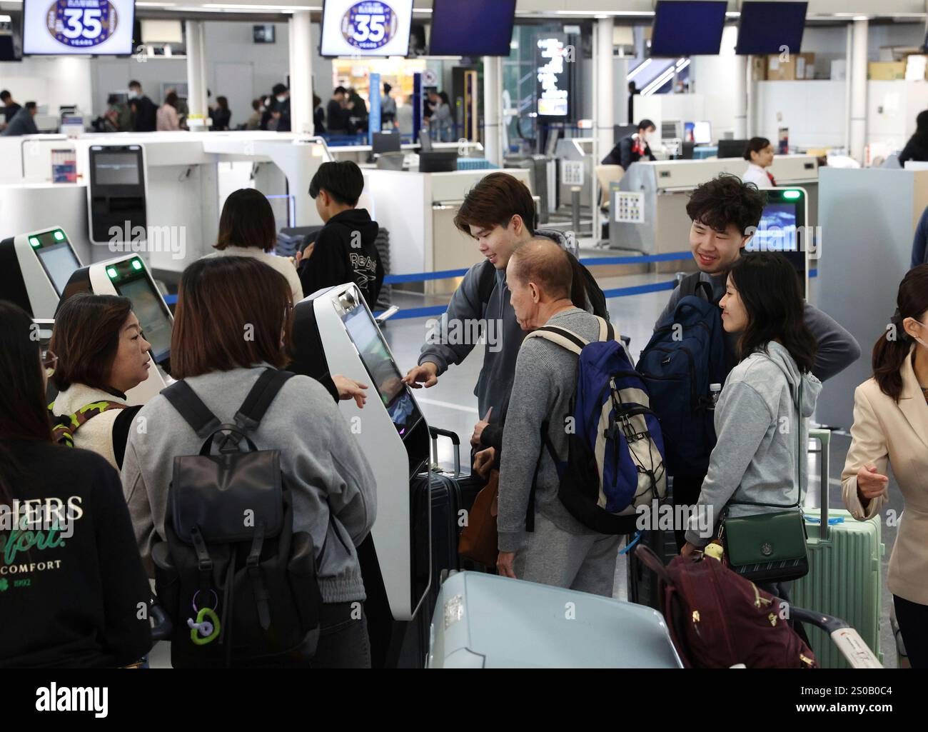 The departure lobby for domestic flights is crowded with people heading to their hometown and ...