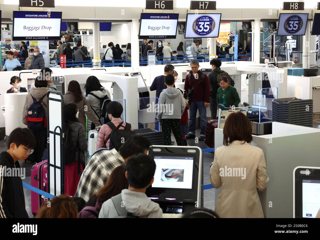 The departure lobby for domestic flights is crowded with people heading to their hometown and ...