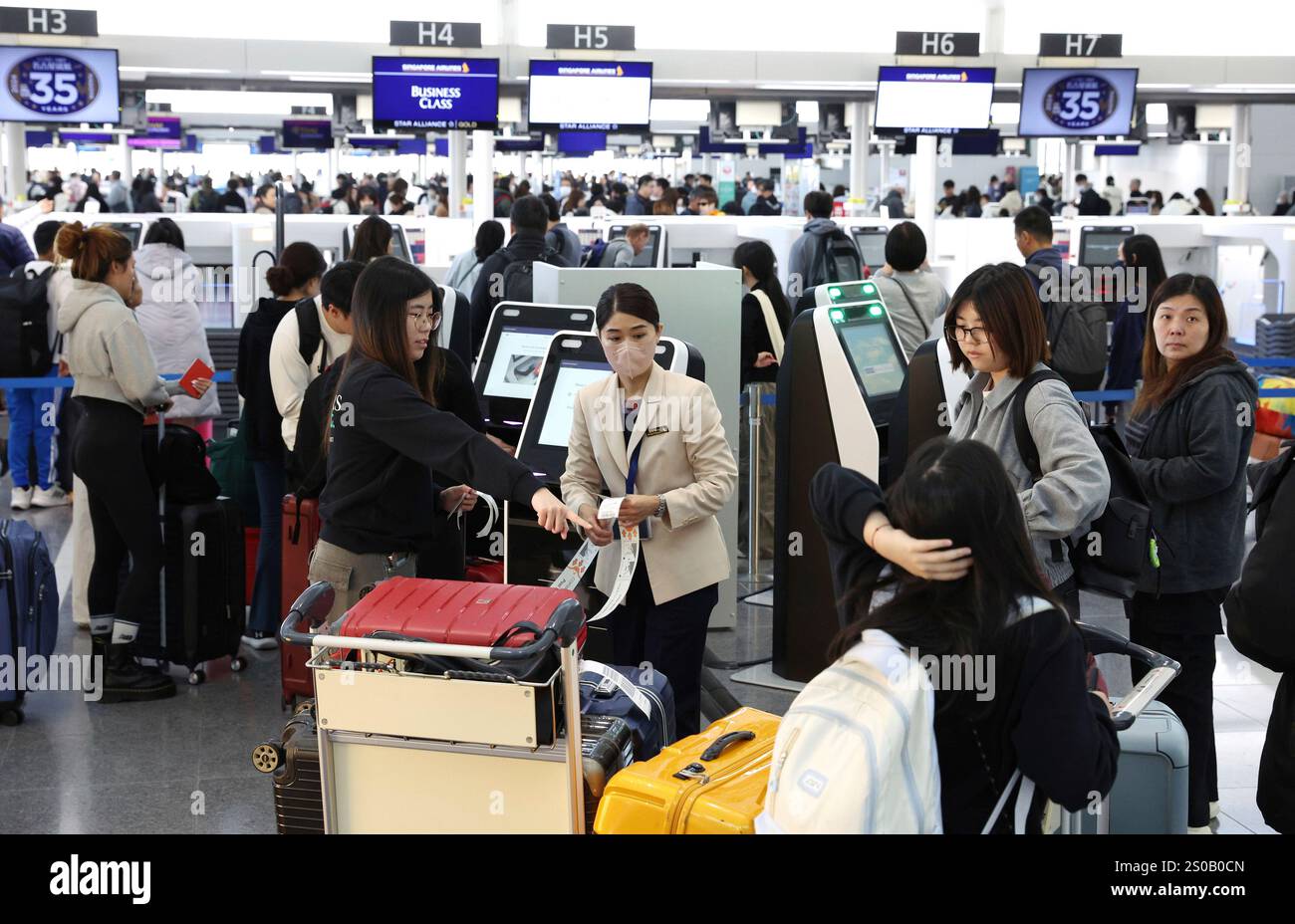 The departure lobby for domestic flights is crowded with people heading to their hometown and ...