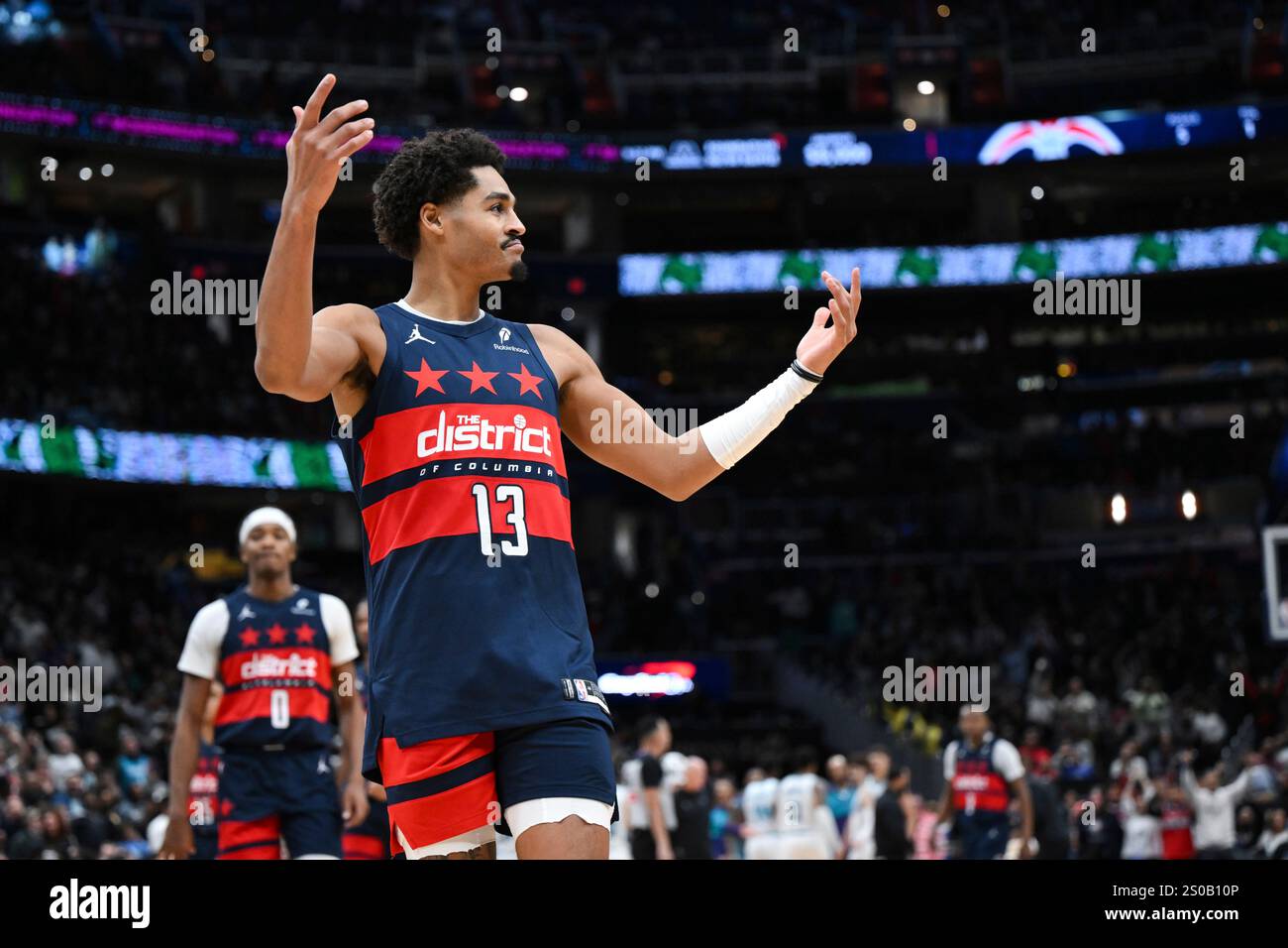 Washington Wizards guard Jordan Poole (13) reacts after making the ...